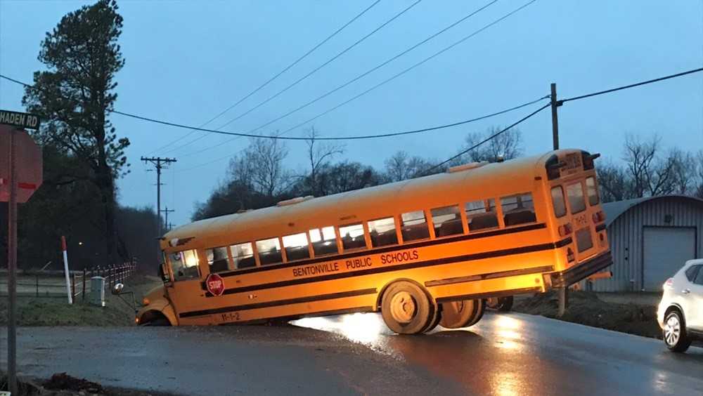 Crews work to pull Bentonville School bus from ditch