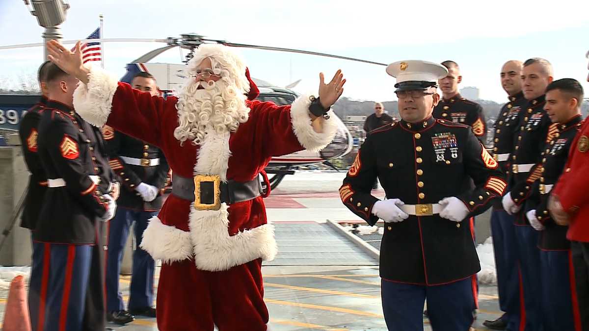 Santa ditches his reindeer and arrives to Children's Hospital in style