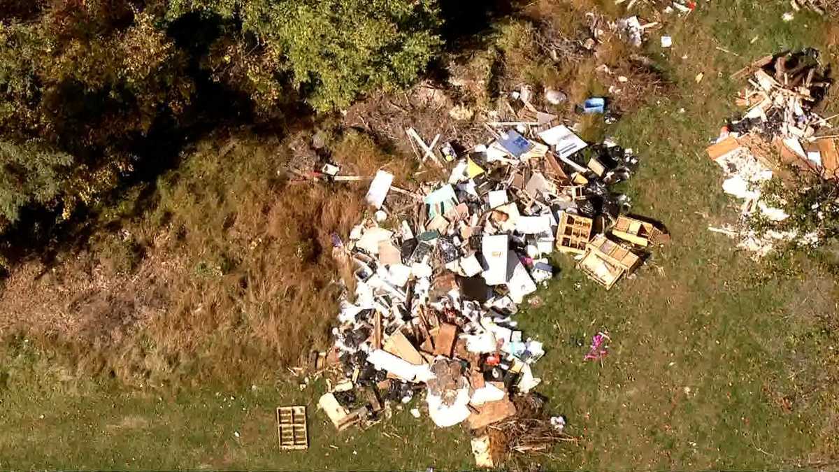Residents upset as trash pile doubles in Edmondson Village