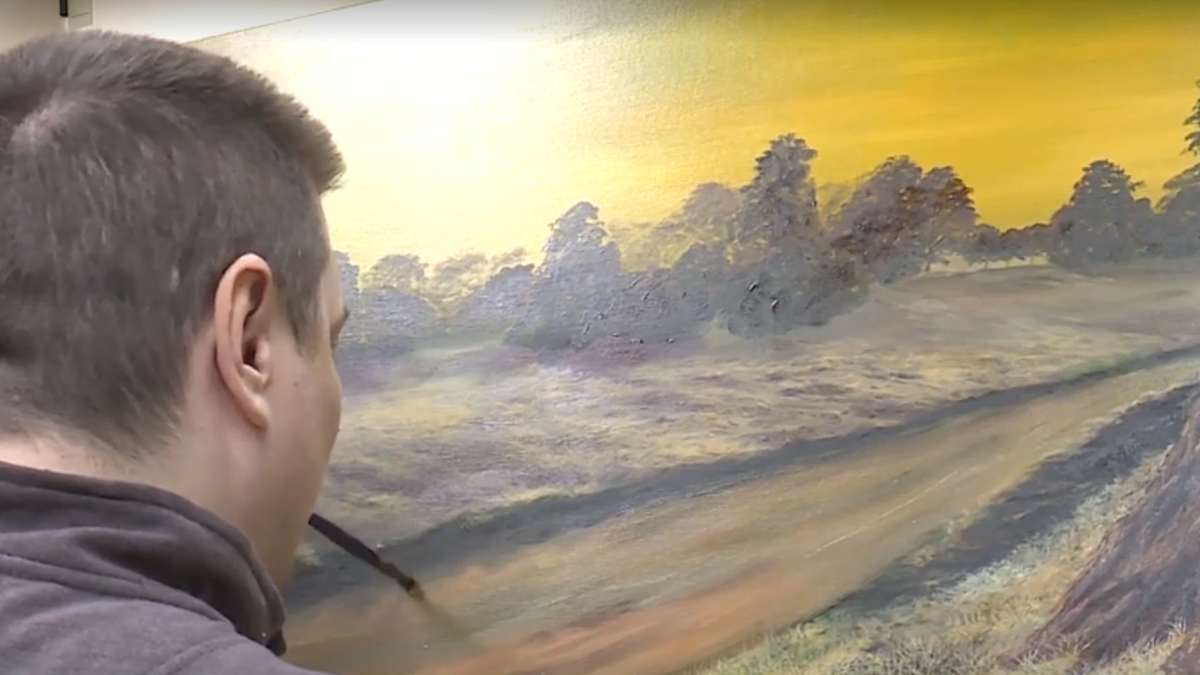 Paralyzed man overcomes adversity to create beautiful works of art