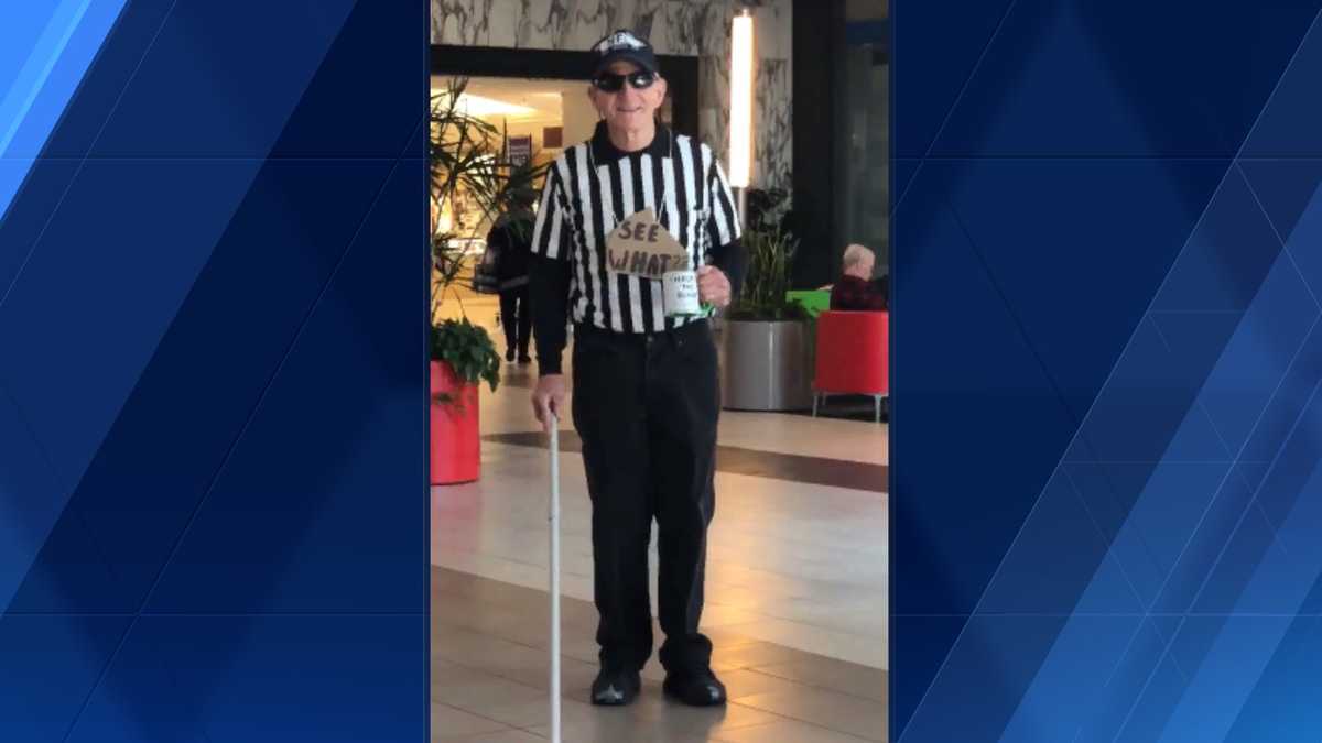 Caught on camera: 'Blind' referee with 'See What' sign walking around ...