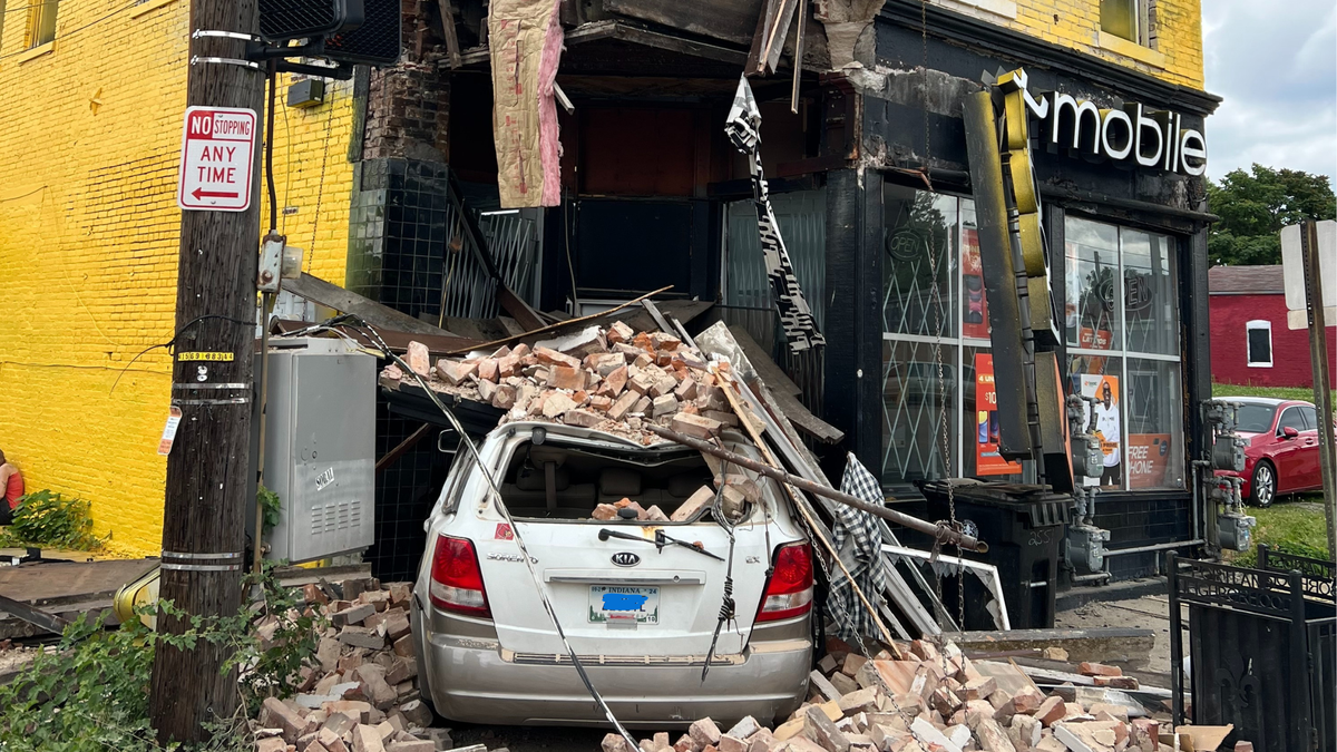 PHOTOS: Car crashes into Louisville Boost Mobile building