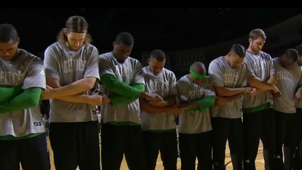 Boston Celtics interlock arms during national anthem before preseason ...