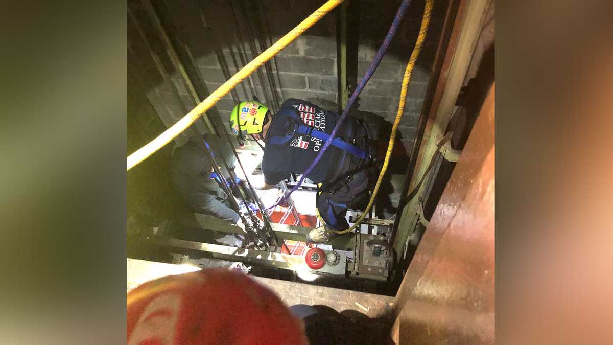 Boston firefighters rescue two people trapped in elevator
