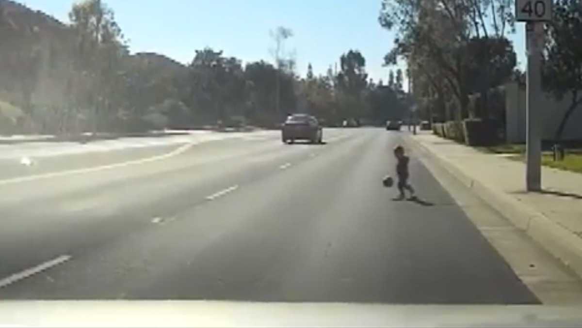 Frightening video: Toddler chasing ball in busy street rescued by ...