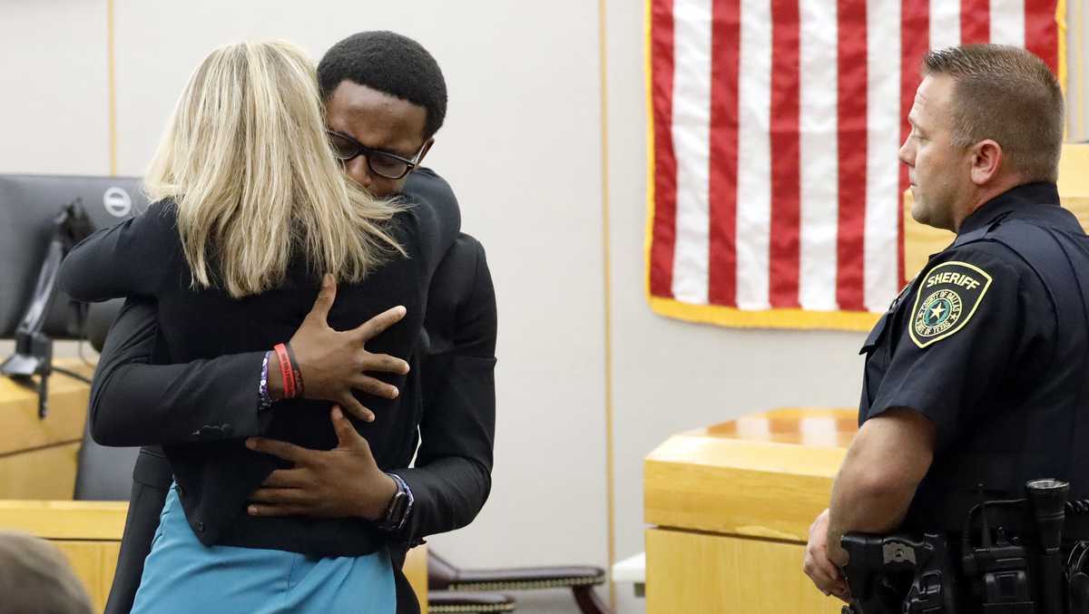 'I love you as a person': Brother of man killed by ex-Dallas cop hugs ...