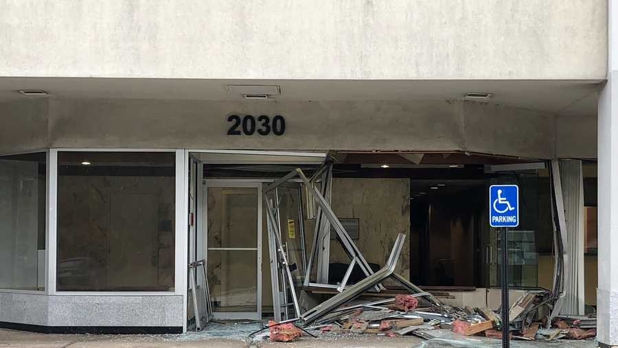 Vehicle slams into building in Forest Hills