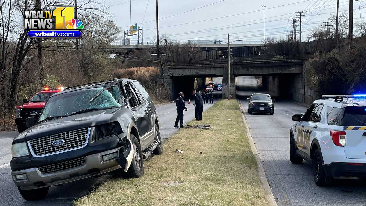 SUV driver injured after concrete falls from railroad bridge
