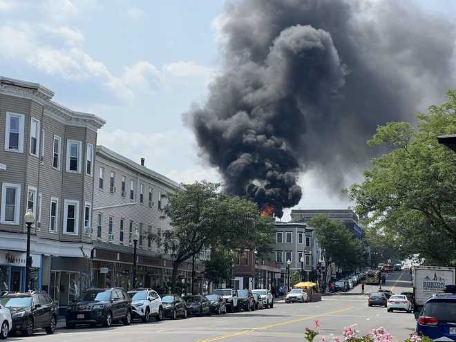 Boston firefighters respond to burning rooftops along E. Broadway