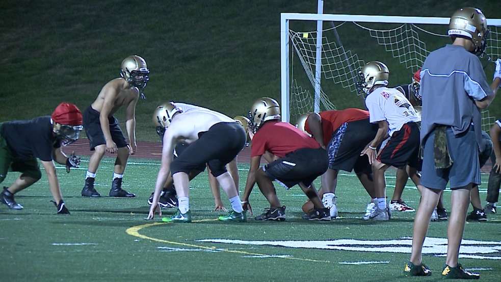 Burning the midnight oil: Omaha Bryan High football players begin practice