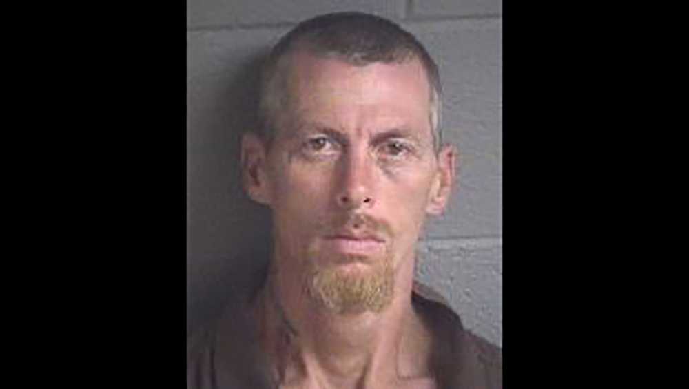 Man arrested for killing man at campsite behind business, police say