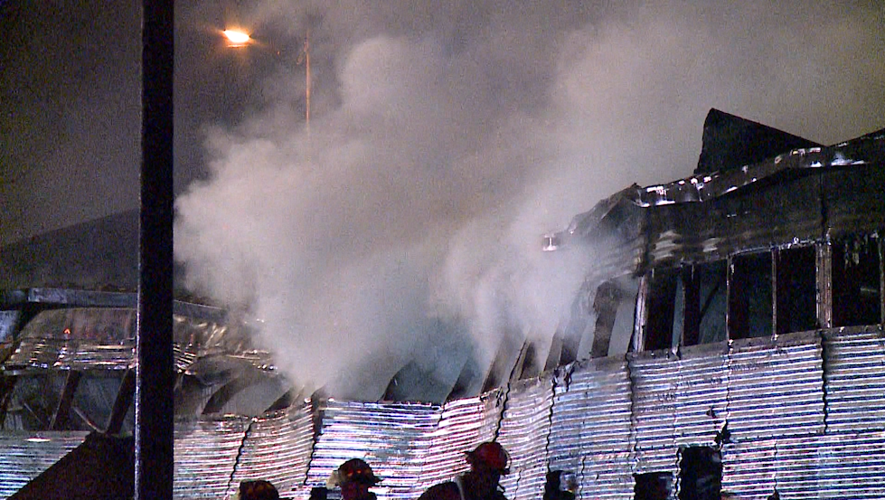 Roof partially collapses in building fire