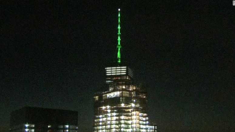 US buildings light up green in solidarity with Paris climate accord