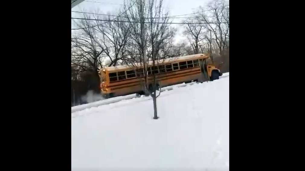 Crazy video shows school bus spinning wheels, struggling to make it up ...