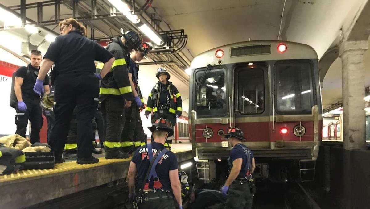 Dramatic photos show rescue of woman stuck between train, platform