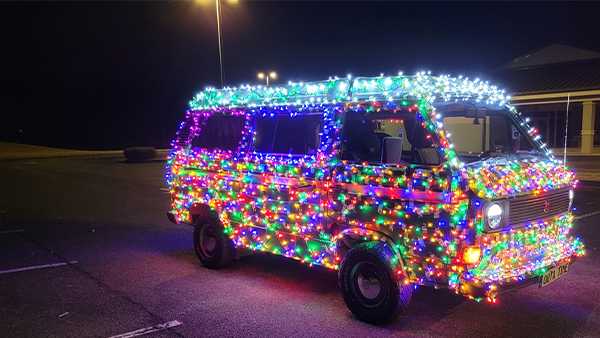 You can't miss this brightly-lit camper van rolling around Elizabethtown