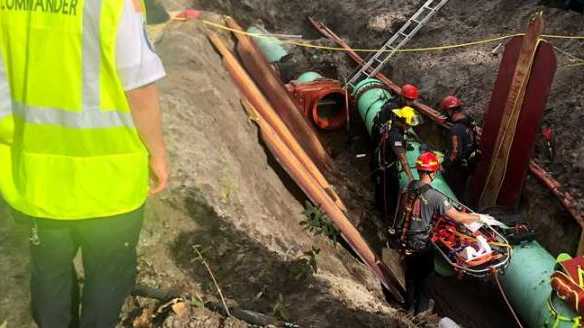 Florida fire crews rescue person trapped under pipe in trench