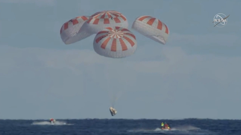 SpaceX crew capsule ends test flight with splashdown off Florida coast