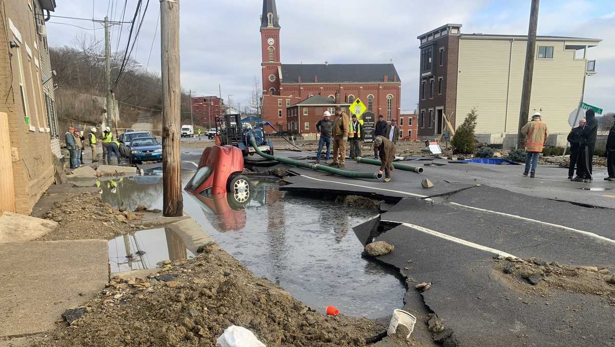 Road closed until further notice after water main break causes sinkhole ...