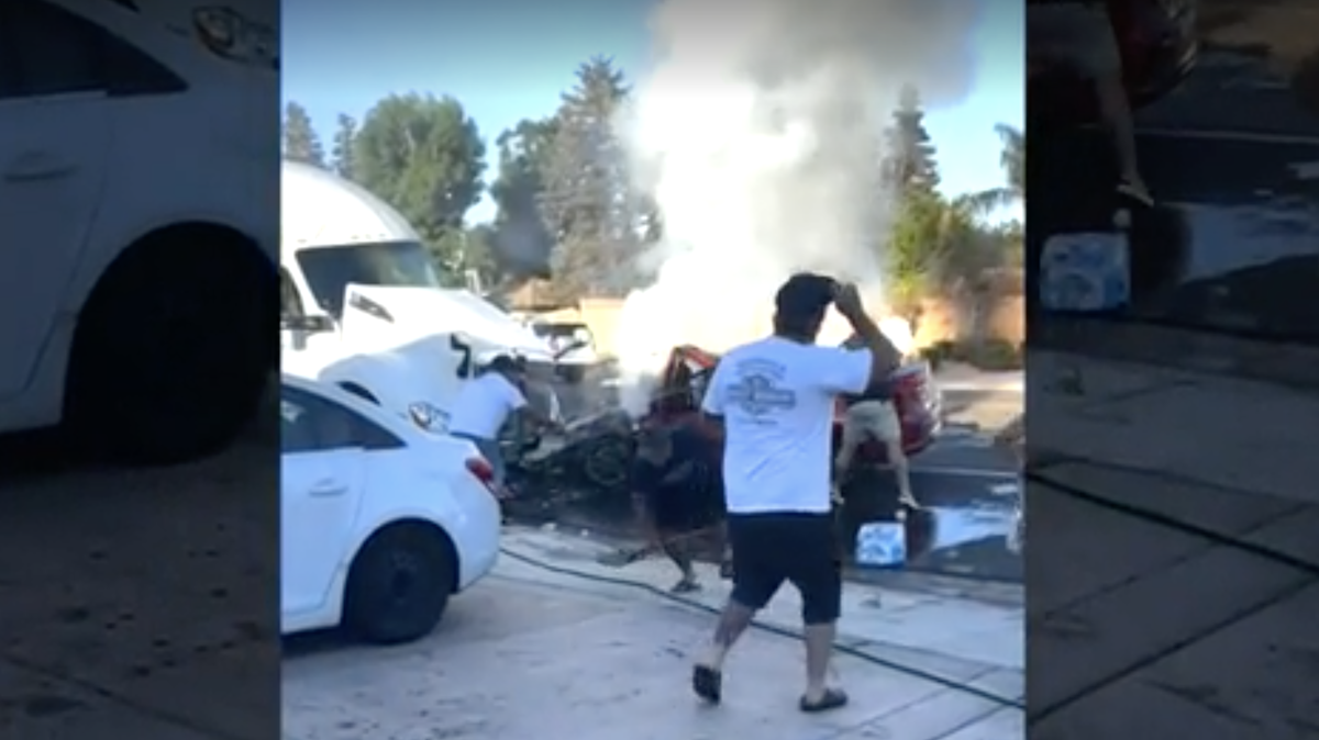 Video shows good Samaritans rescuing man from burning car