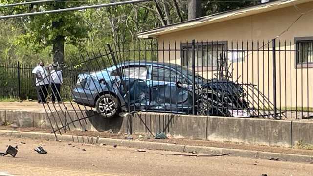 Driver takes off from traffic stop, hits utility poles, gate