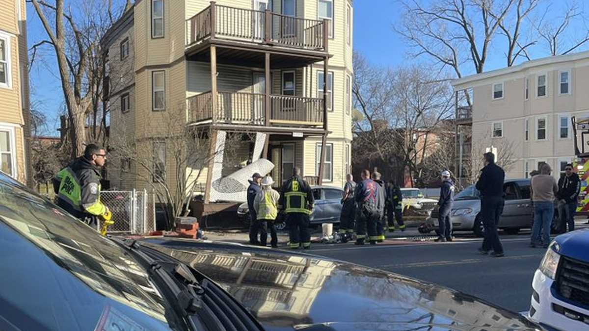 Officials ID man killed when car crashes into Boston triple-decker