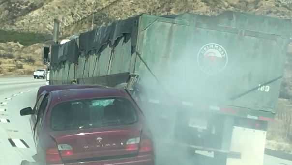 'He's not stopping': Video shows semi dragging car along interstate