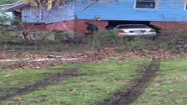 Car slams into house off McDowell Road