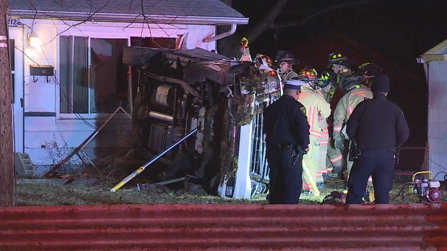 Police: Driver tries to flee after car overturns, crashes into house in ...