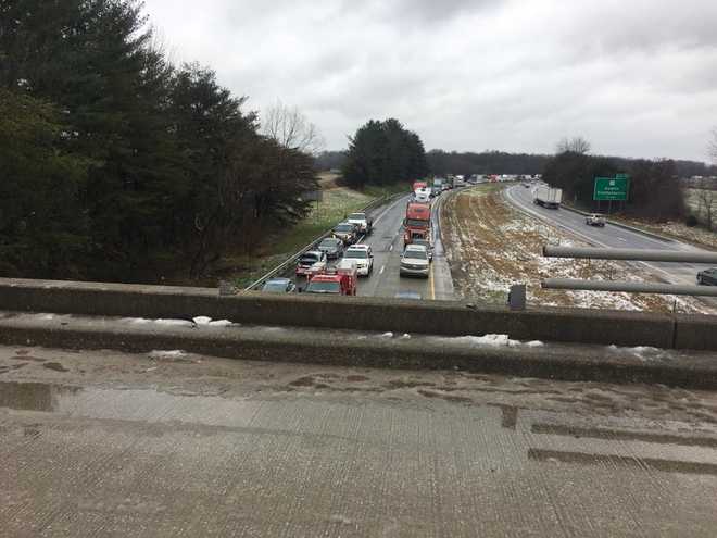 Car slides off overpass, falls onto vehicle in Jackson County