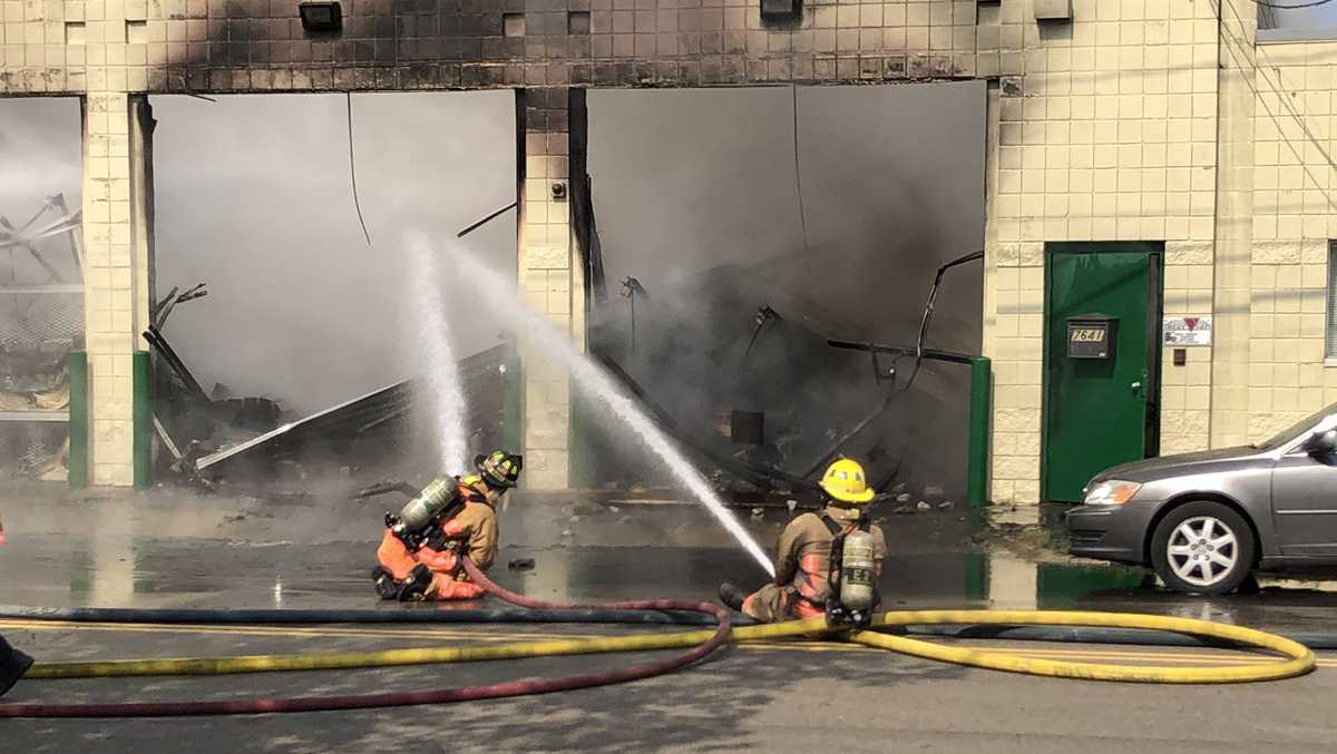 Crews battle large fire at car restoration business in Roselawn