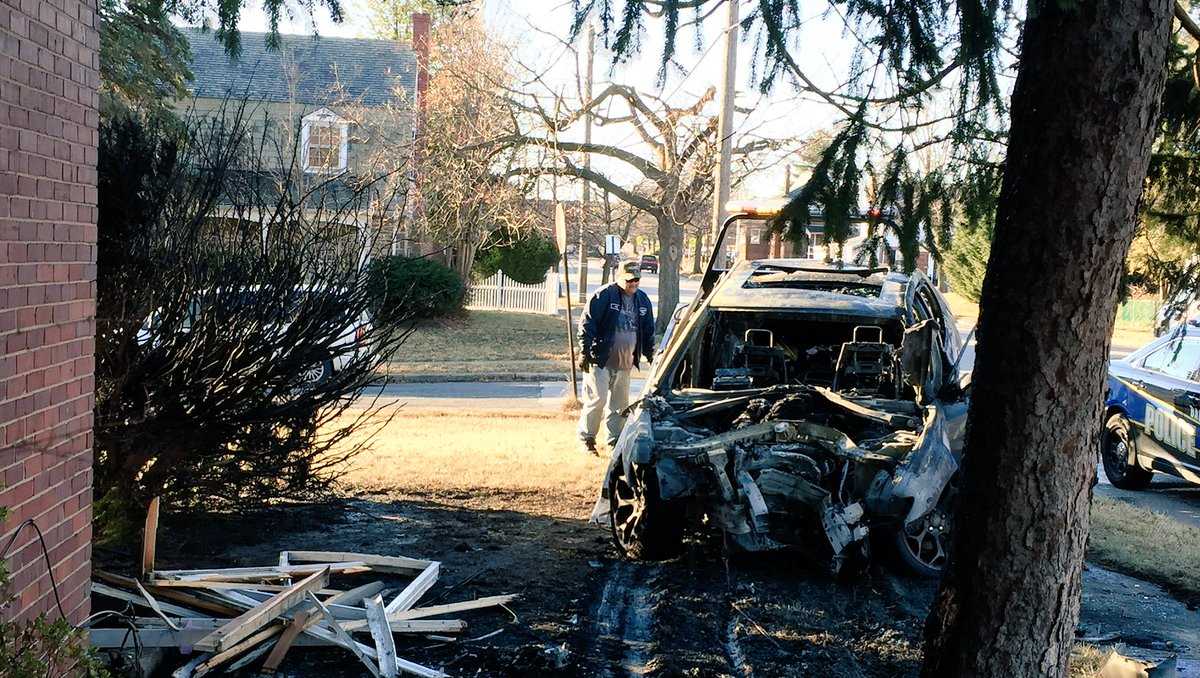 Car hits patch of ice, slams into tree, catches fire in Baltimore