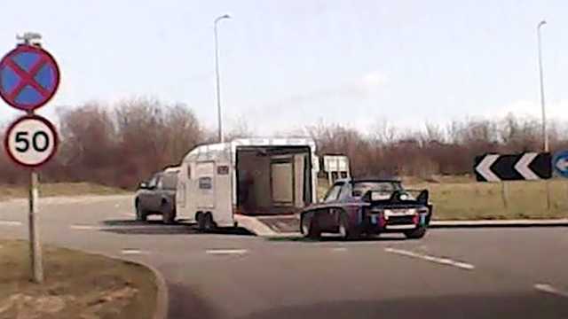 Whoops! Video shows expensive car falling out of trailer onto road