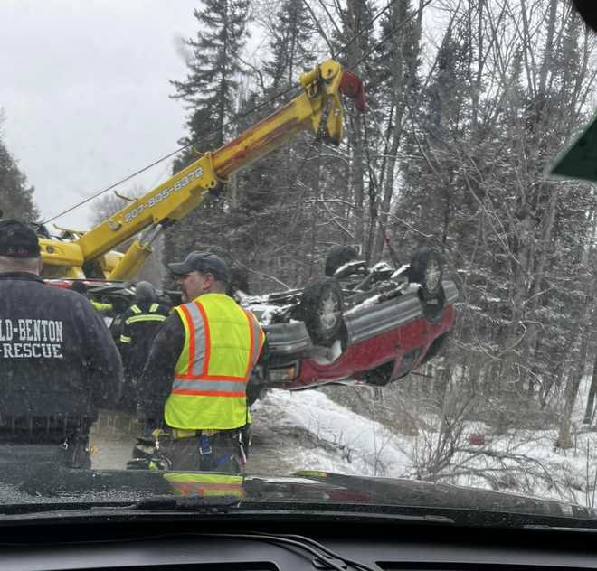 Clinton police retrieve driver's remains, wrecked car from frozen pond
