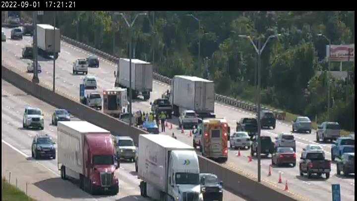 Police respond to a crash blocking a lane along the interstate