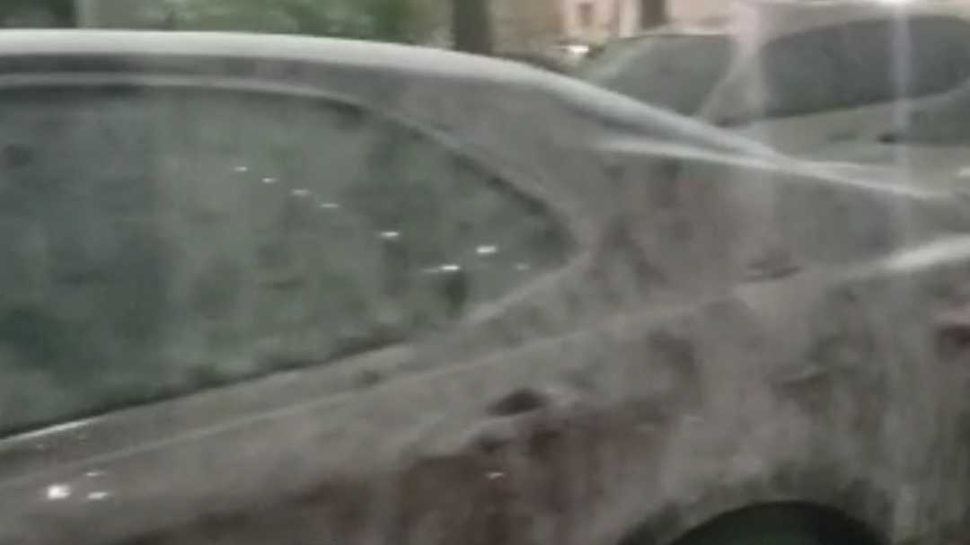 Vehicles left covered in cement