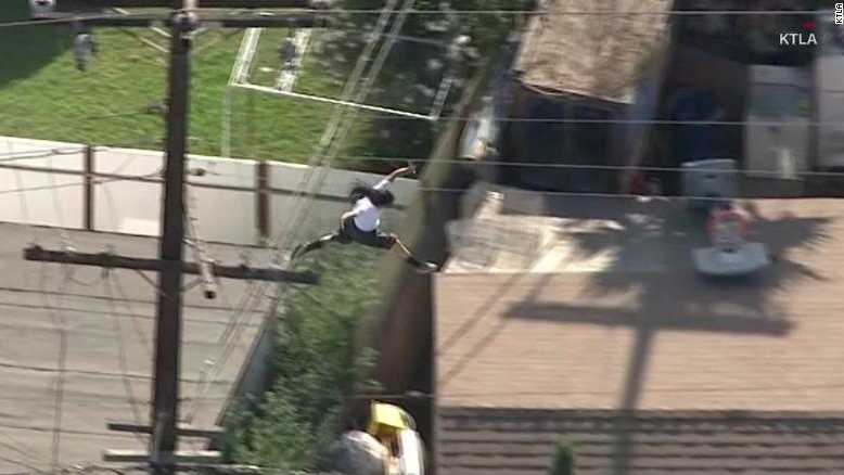Suspect jumps rooftops in wild police chase