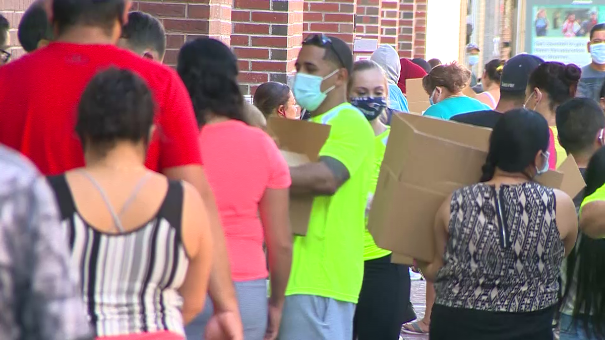 Residents wait in line for food, rent assistance in hard-hit Chelsea