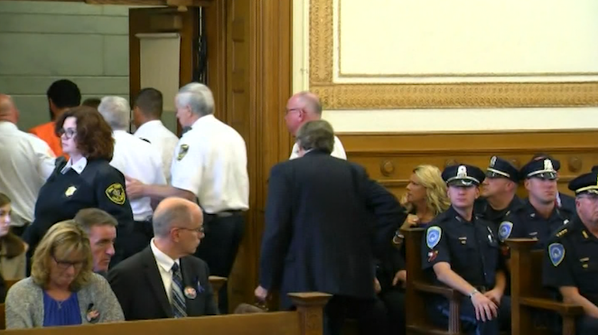 Slain police sergeant's widow shouts at accused killer