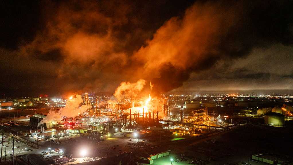 Flames are visible for miles after a fire erupts at a Chevron refinery ...