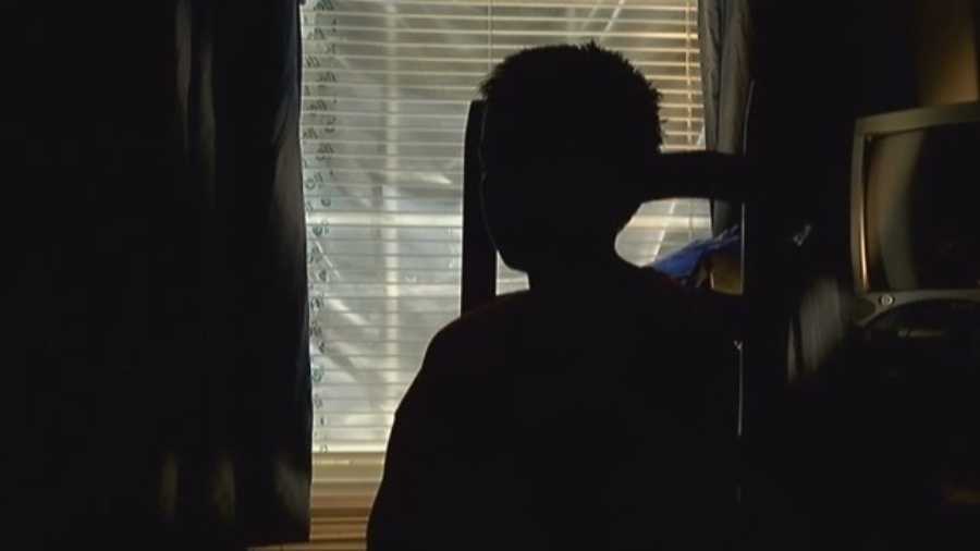 Boy chained with dead chicken around neck sues former foster parent