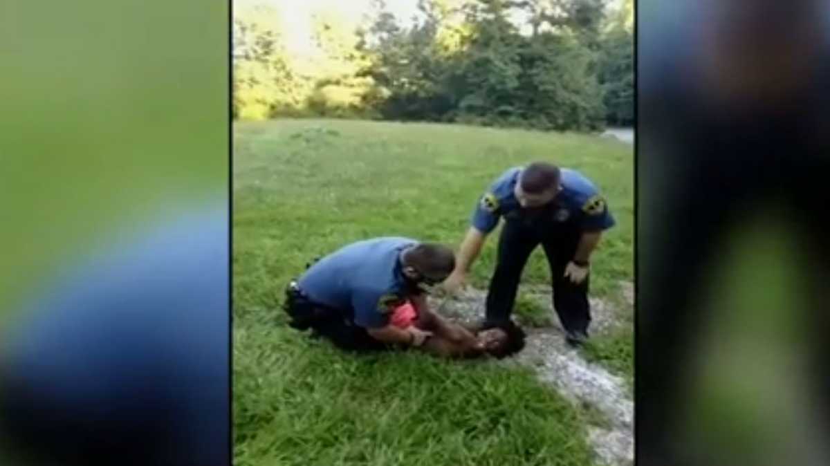 Viral video shows police restraining crying 9-year-old during father's ...