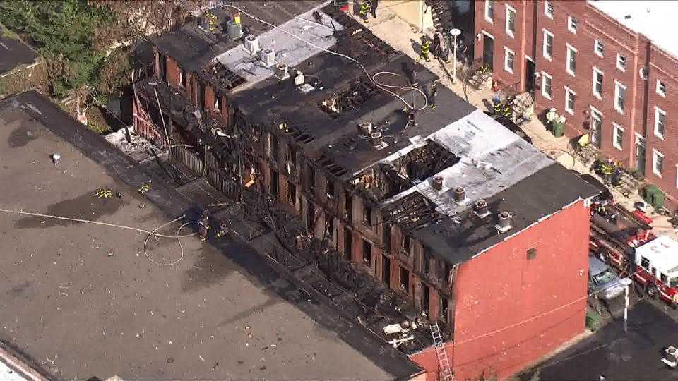 2 firefighters injured, 25 displaced after multiple rowhomes fire