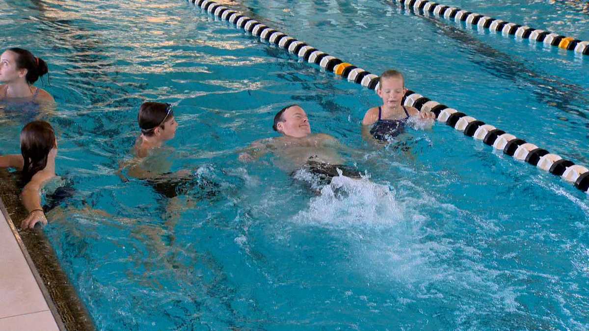 Eastern Shore swim team volunteering with special athletes to sit in ...