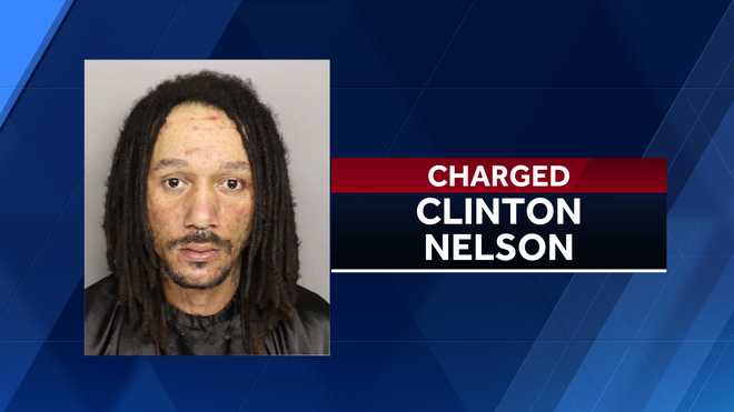 Man charged after car hits building, passenger killed, police say