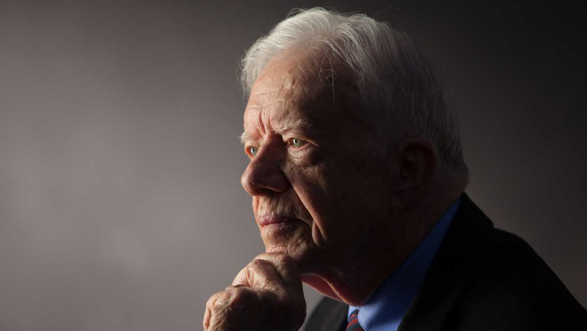 Former President Jimmy Carter's motorcade arrives at The Carter Center