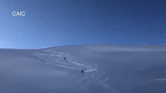 Video shows avalanche in Colorado partially buried a snowmobiler