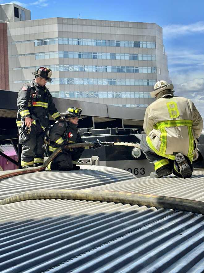 Boston firefighters extinguish fire on Commuter Rail train engine