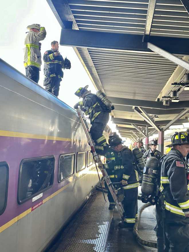 Boston firefighters extinguish fire on Commuter Rail train engine