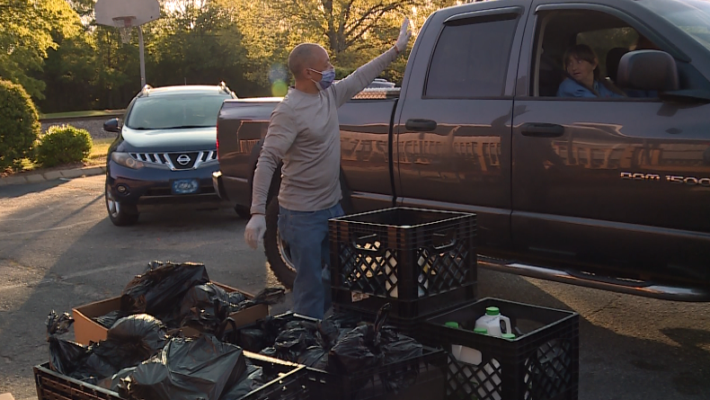 Church converts food pantry for drive-thru grocery pick-up